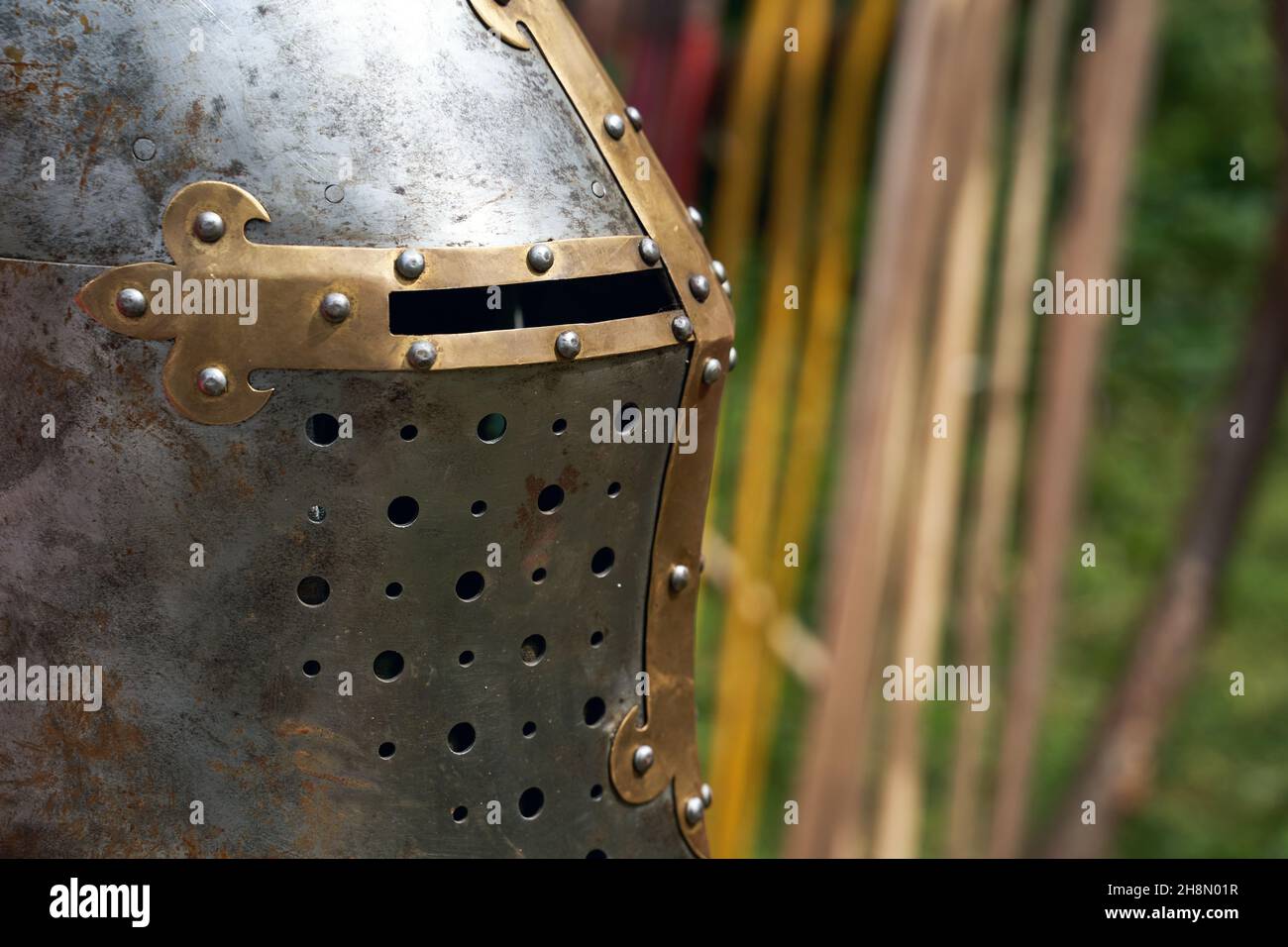 Knight metal helmet closeup on spears background. Historical ...