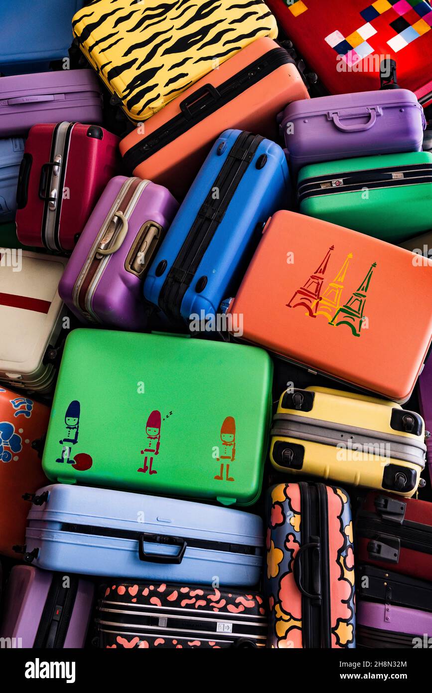 Many colourful travel suitcases Stock Photo - Alamy