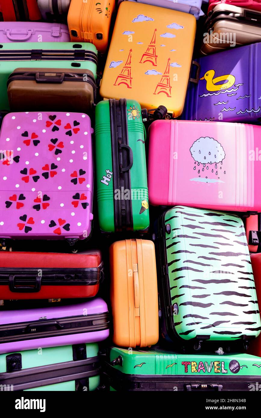 Many colourful travel suitcases Stock Photo - Alamy