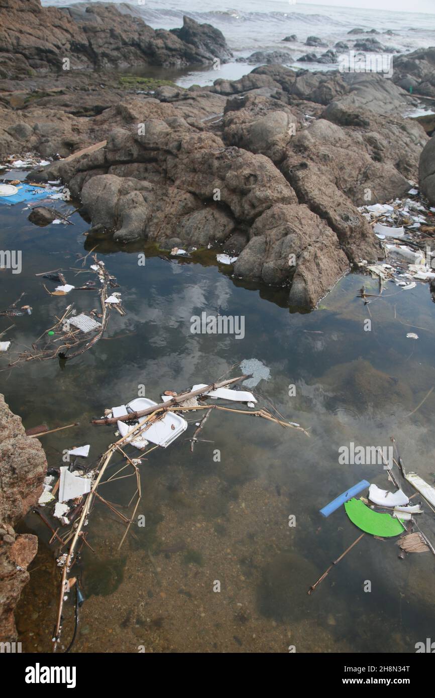 salvador, bahia, brazil - november 30, 2021: Plastic bottle and heaped garbage is seen in the ...