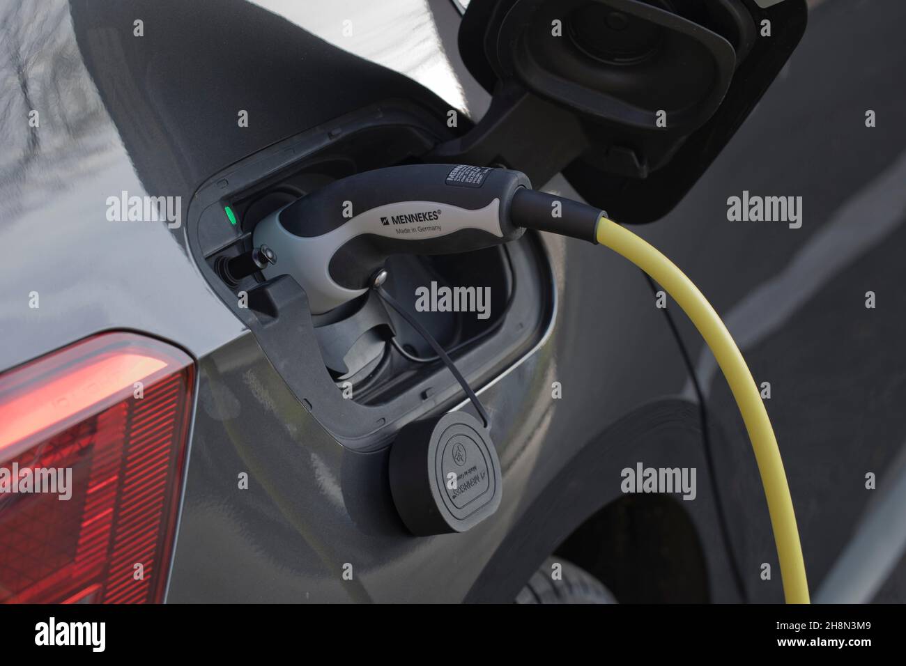 Electric car being charged, Berlin, Germany Stock Photo - Alamy