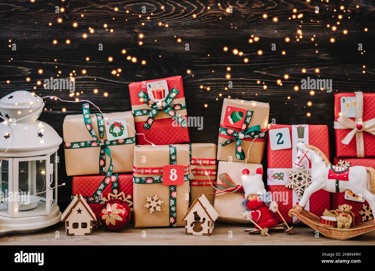 Handmade wrapped red, green gift boxes decorated with ribbons ...