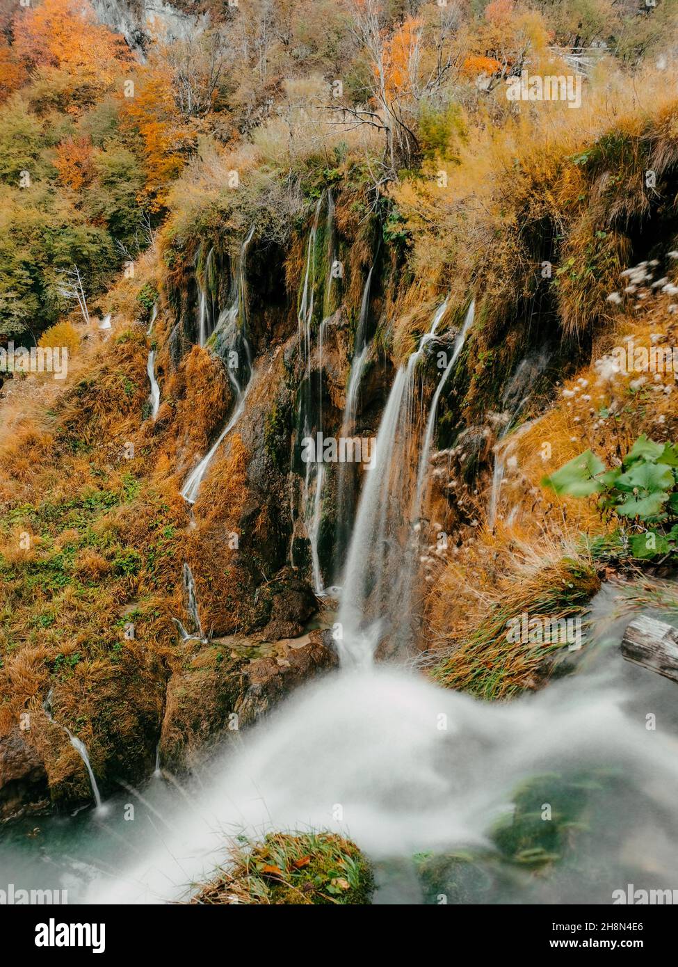 Stunning view of foamy waterfall at famous Plitvice Lakes National Park ...