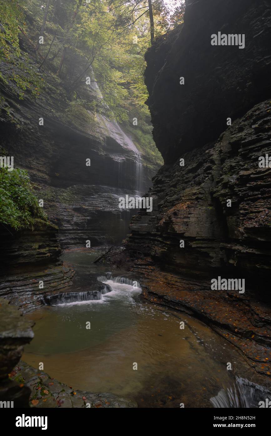 Beautiful shot of a small river flowing across two huge rocks Stock ...