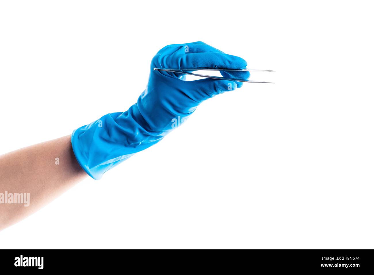 Hand in blue glove holding dental metal instrument isolated Stock Photo ...