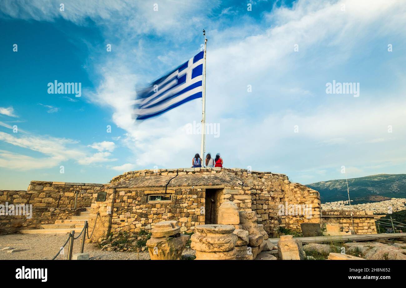Greek flag waving against blue sky Stock Photo - Alamy