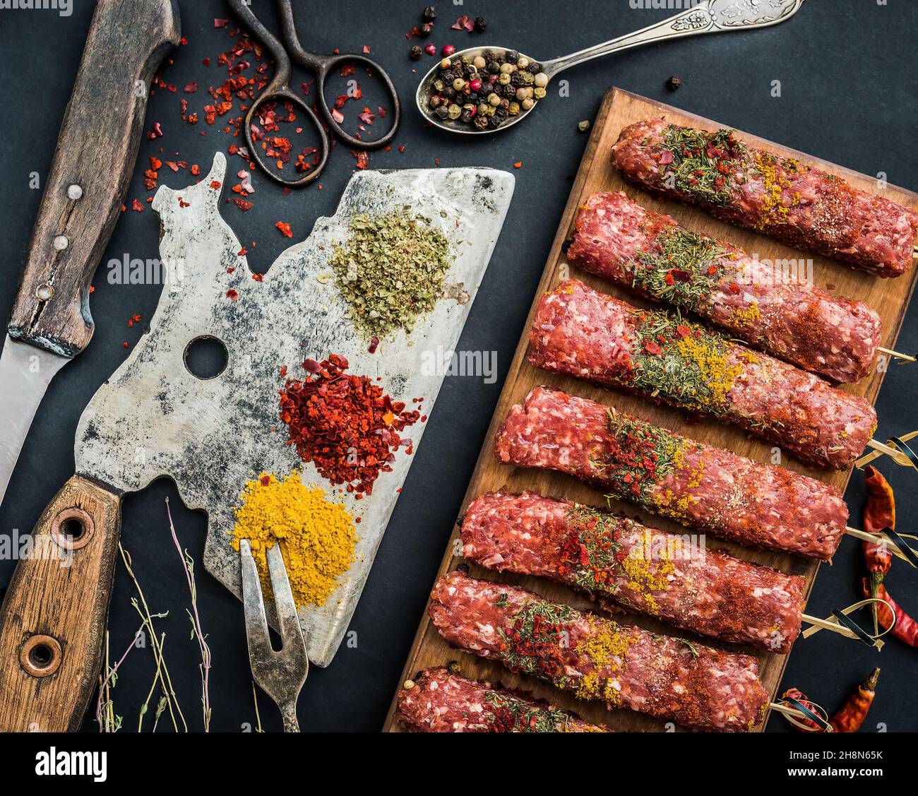 Raw kebab with spices Stock Photo - Alamy