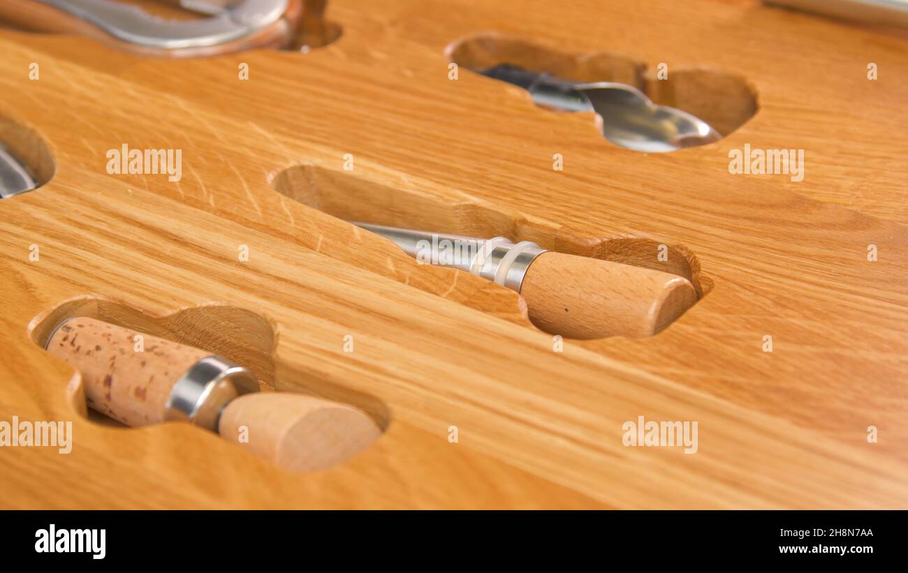 Close-up of wooden box for kitchen tools. Household utensils. Modern stylish design of kitchen ...