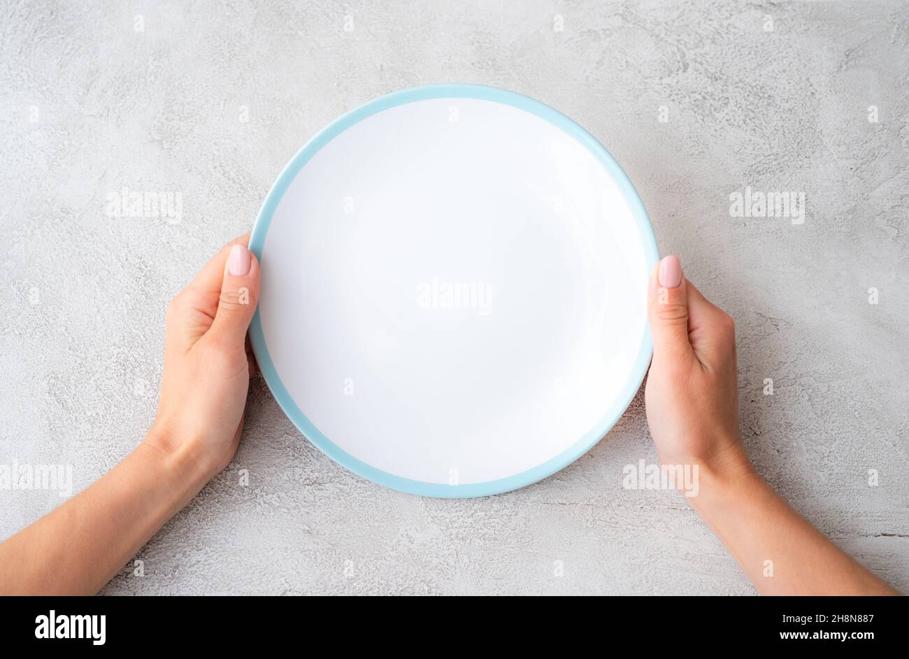 Female hands empty plate hi-res stock photography and images - Alamy