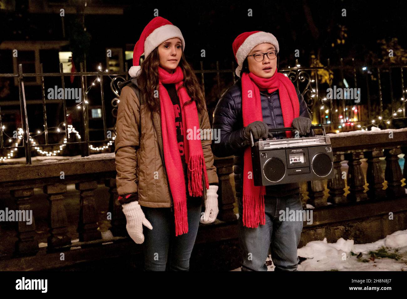 NINA DOBREV and JIMMY O. YANG in LOVE HARD (2021), directed by HERNAN ...