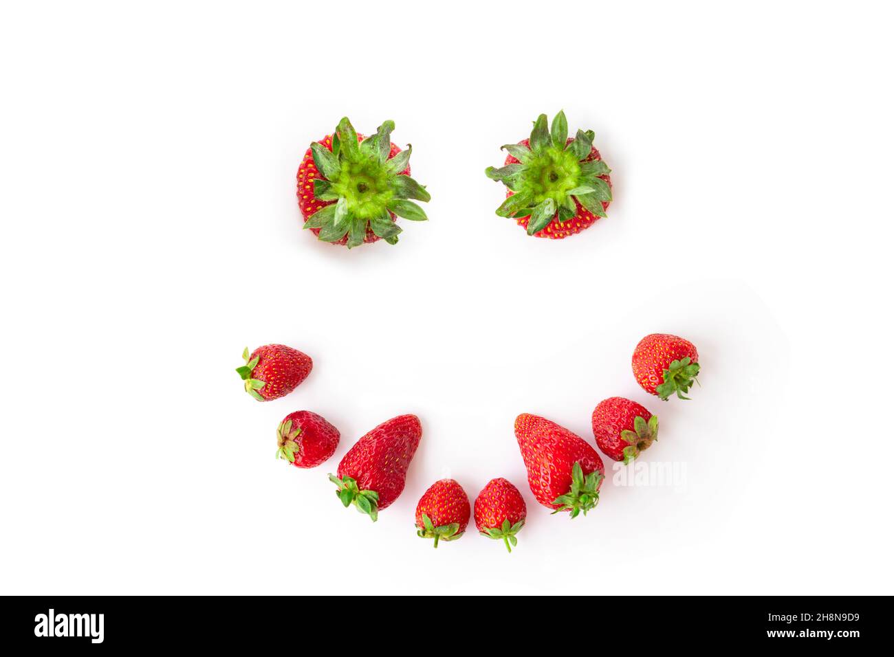 juicy, ripe strawberries on a white background. Strawberry in the shape ...