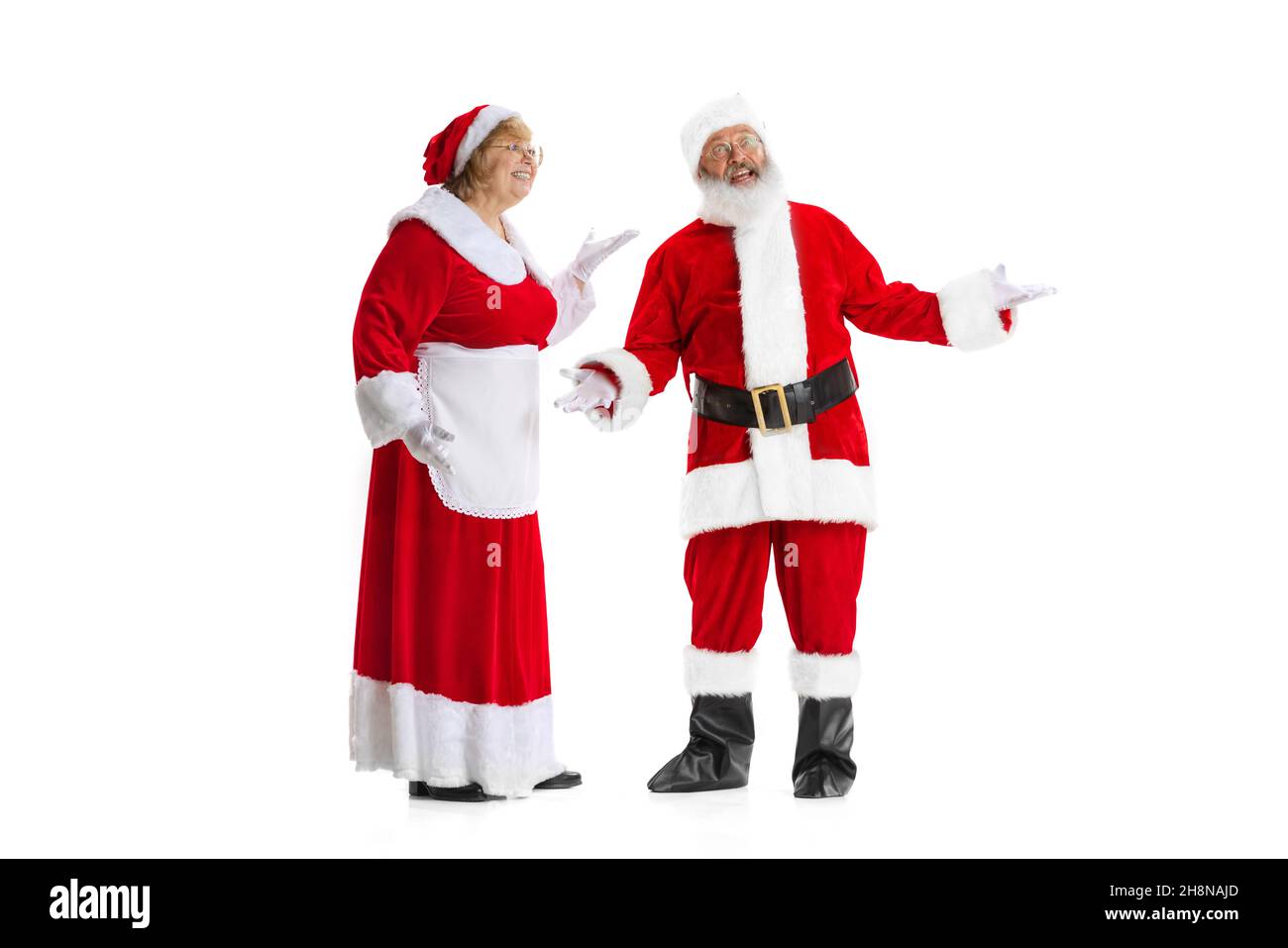 Excited senior man and beautiful woman, Santa Claus and missis Claus in ...