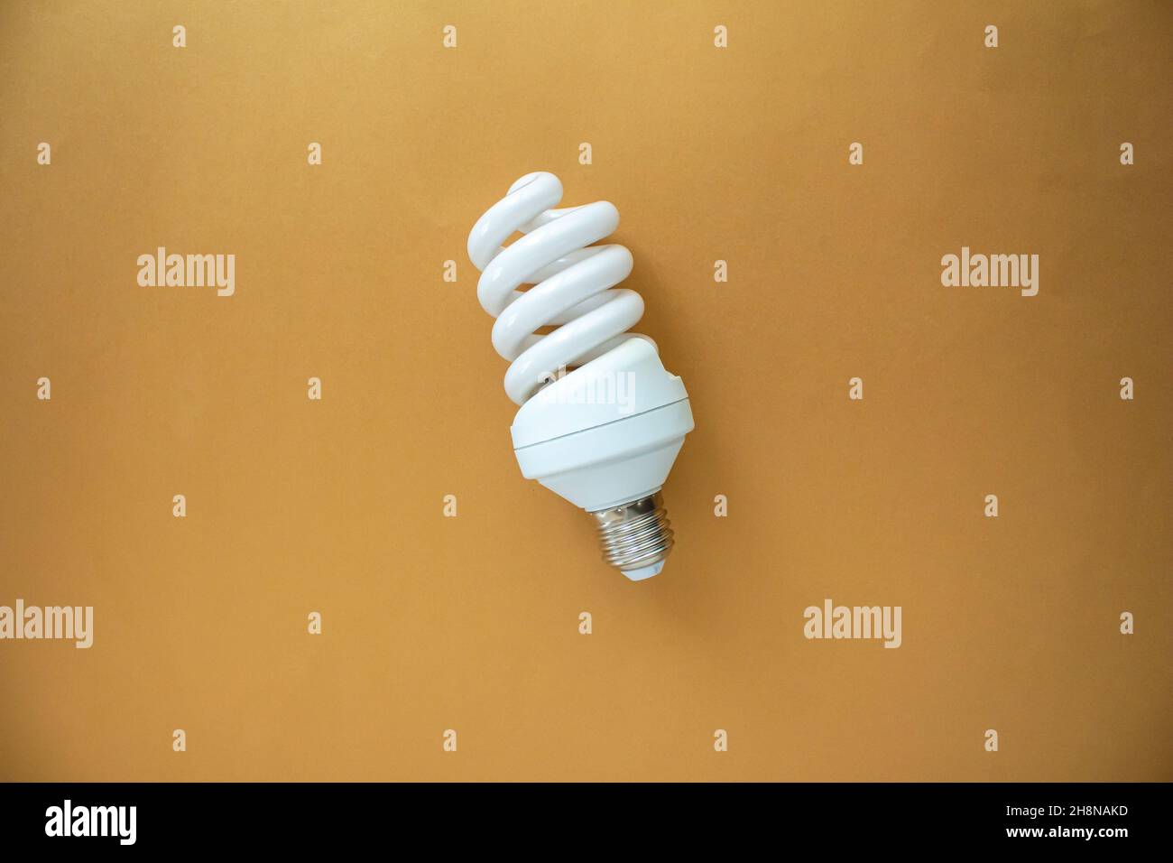 White light bulb, top view of light bulb isolated on colored background ...