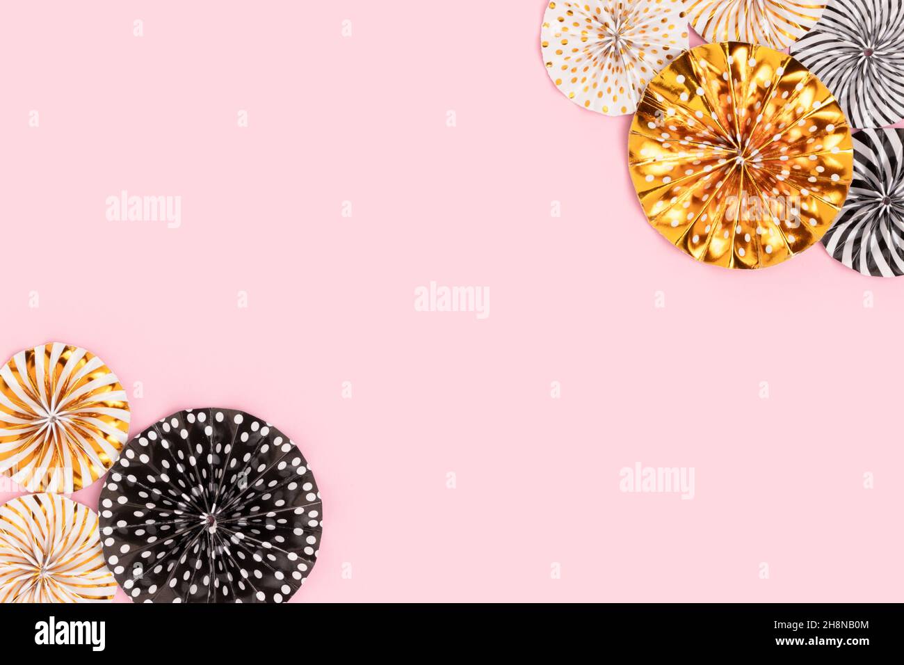 Border frame made of colorful paper fans on a pink background Stock ...