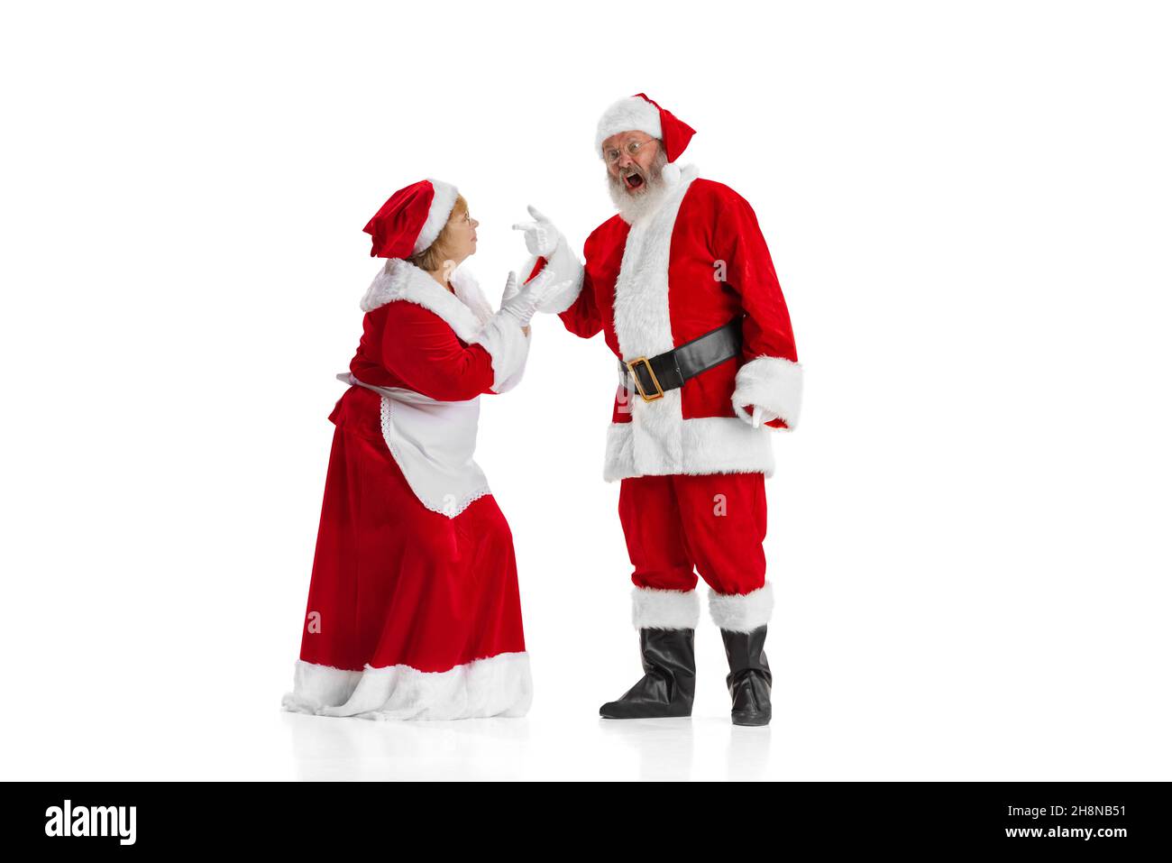 Angry elder man, Santa Claus shouting at woman, missis Claus isolated ...