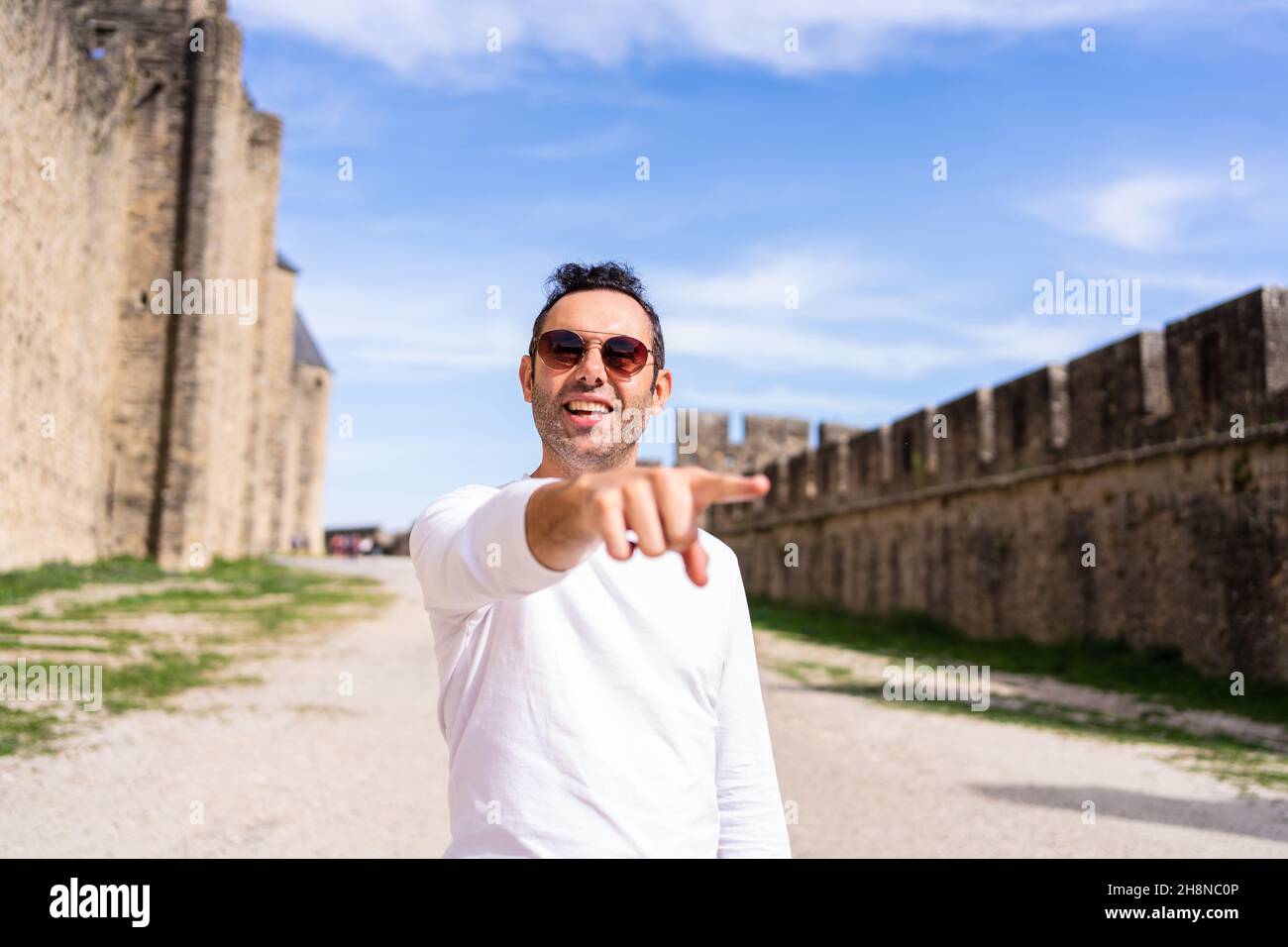Photo with copy space of a man pointing forward standing next to a ...