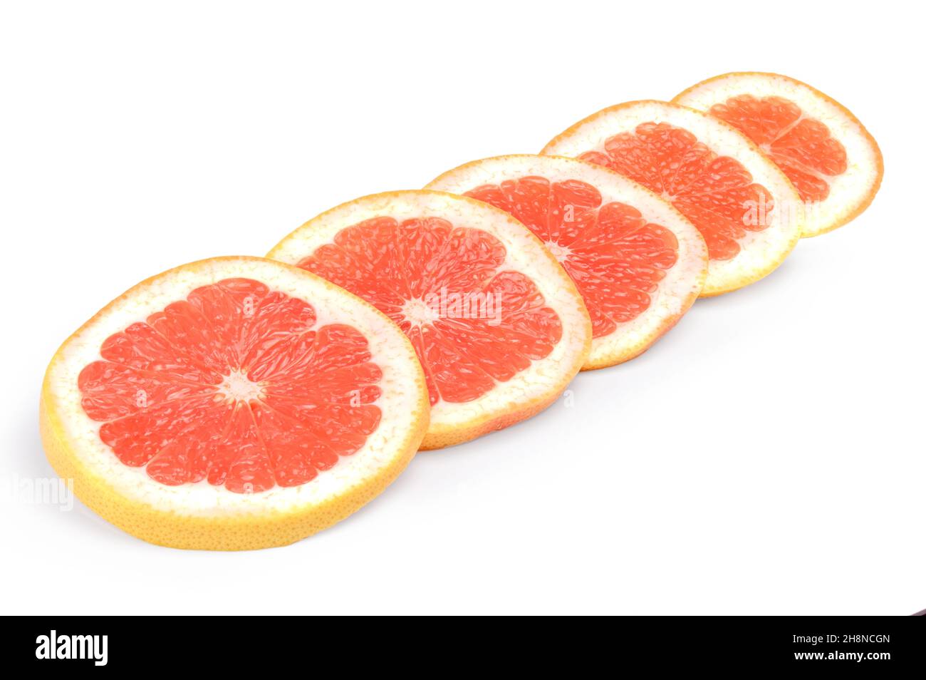 Grapefruit slices isolated on white background Stock Photo - Alamy