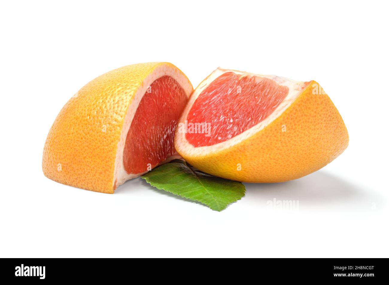 Two wedges of grapefruit on white background Stock Photo - Alamy