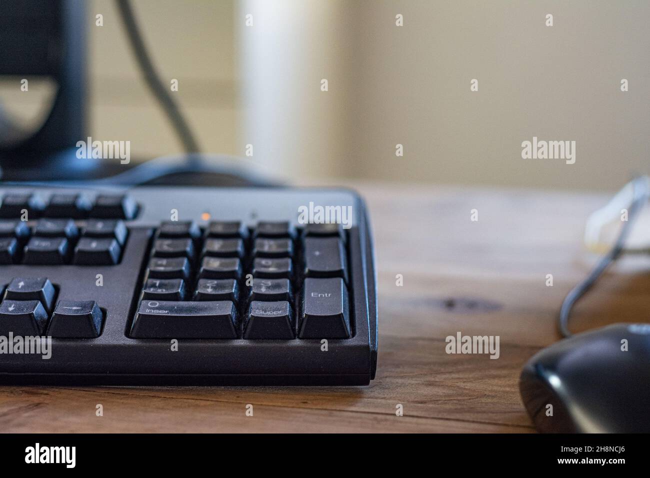 close up view of computer keyboard at table with computer mouse and ...