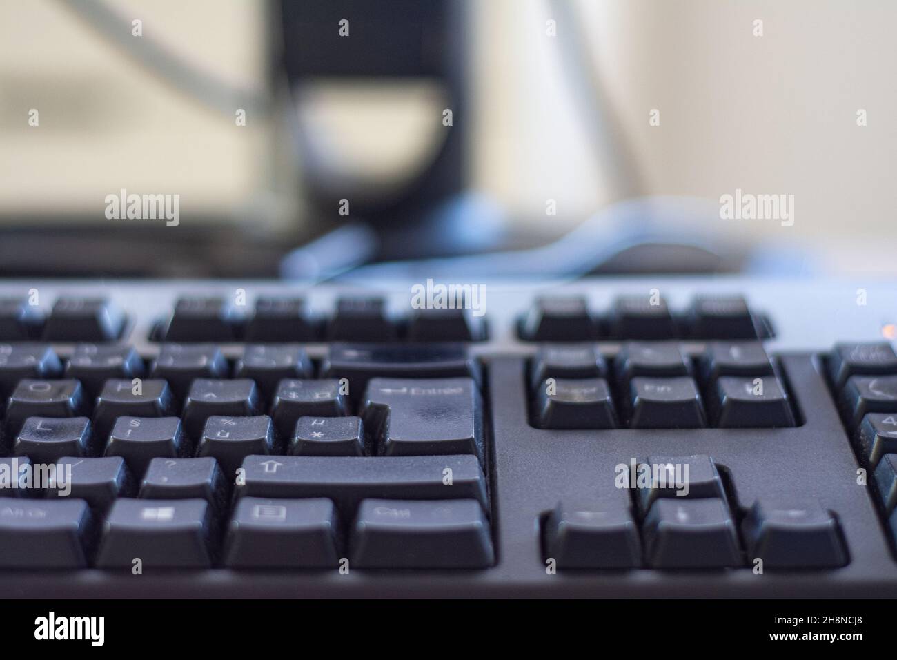 close up view of computer keyboard at table with computer mouse and ...