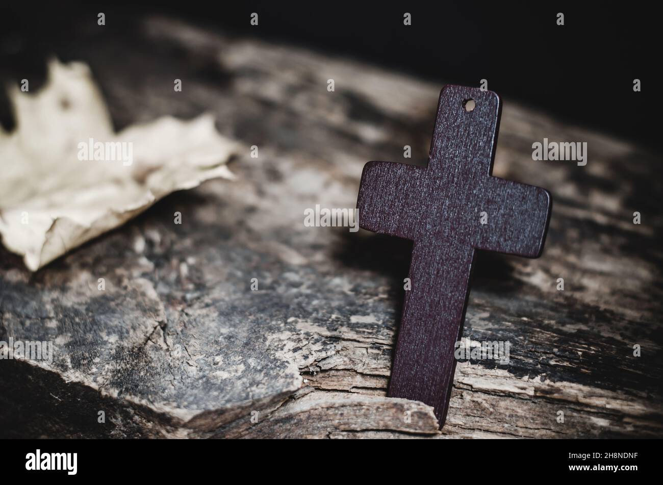 Wooden Christian cross on a wooden table. Religious concept Stock Photo ...