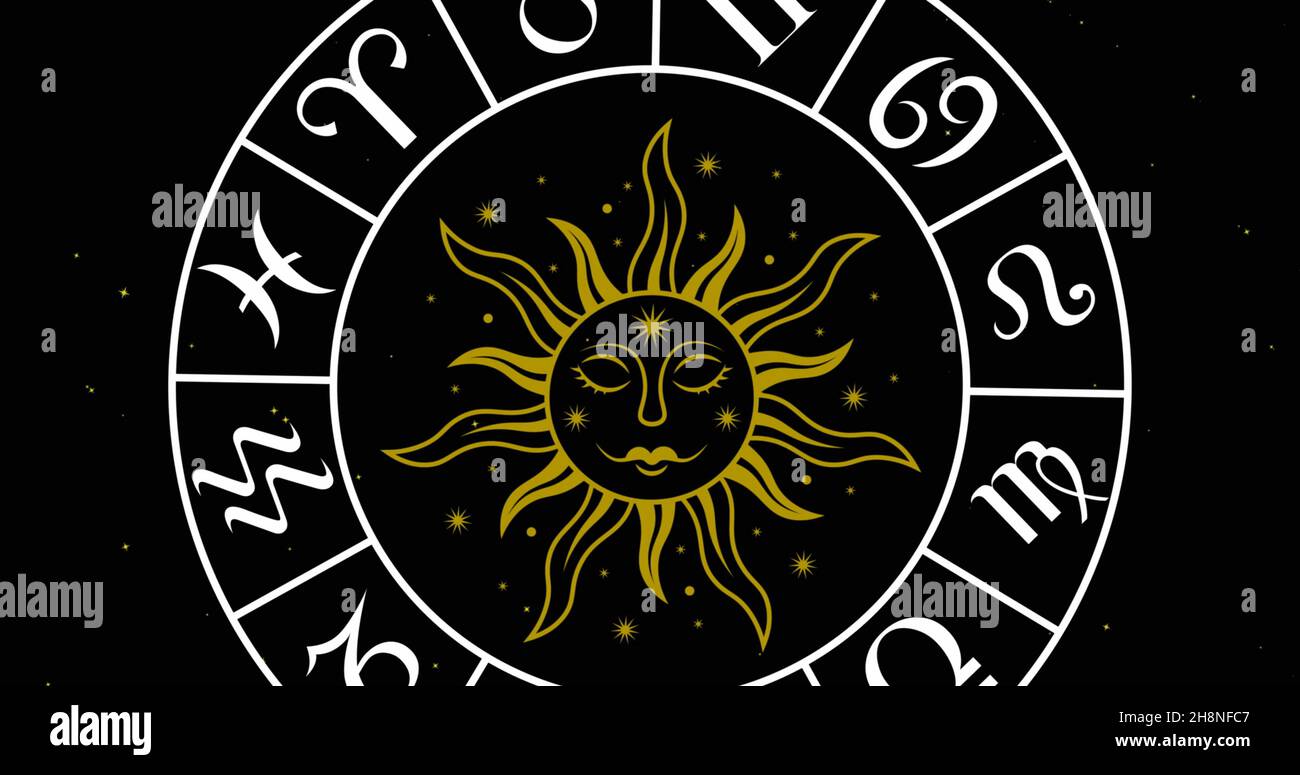 Image of gold sun and zodiac wheel spinning over snow falling on black ...