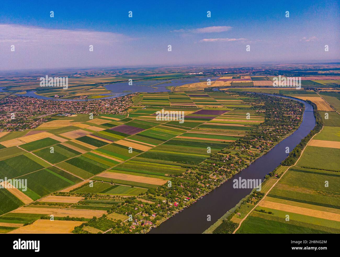 Birds-eye view of land and the Tisa river flowing through it in Serbia ...