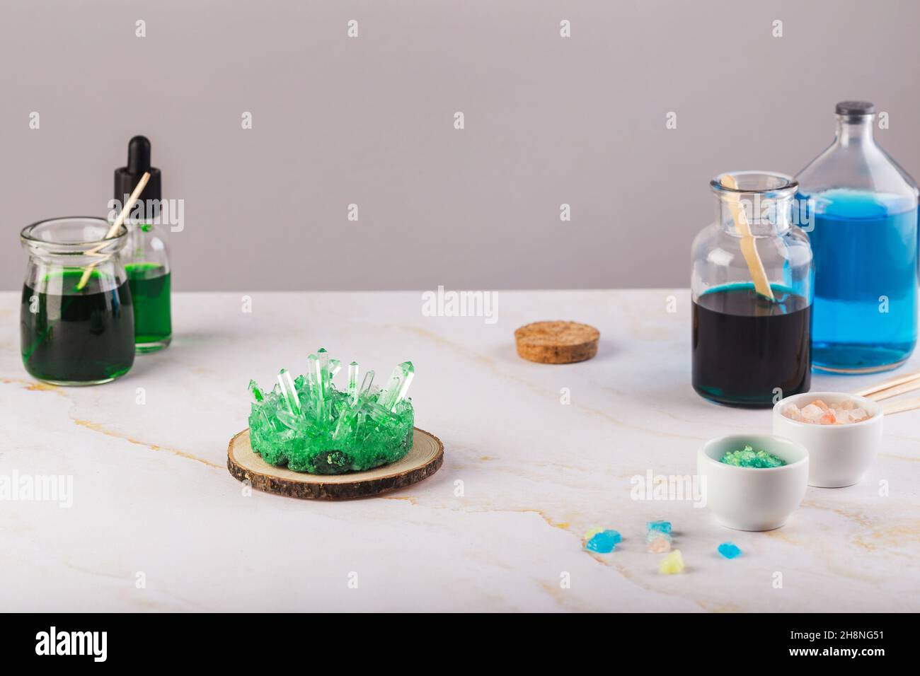 Green crystal grown by a child. Science is fun concept. Experiment with ...