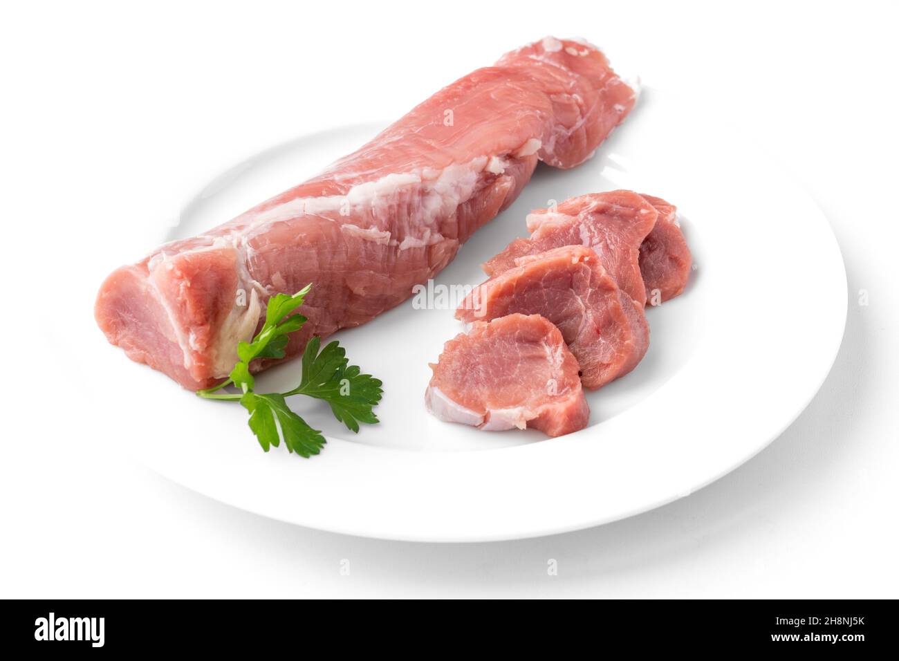 Raw pork tenderloin meat on a white background Stock Photo - Alamy