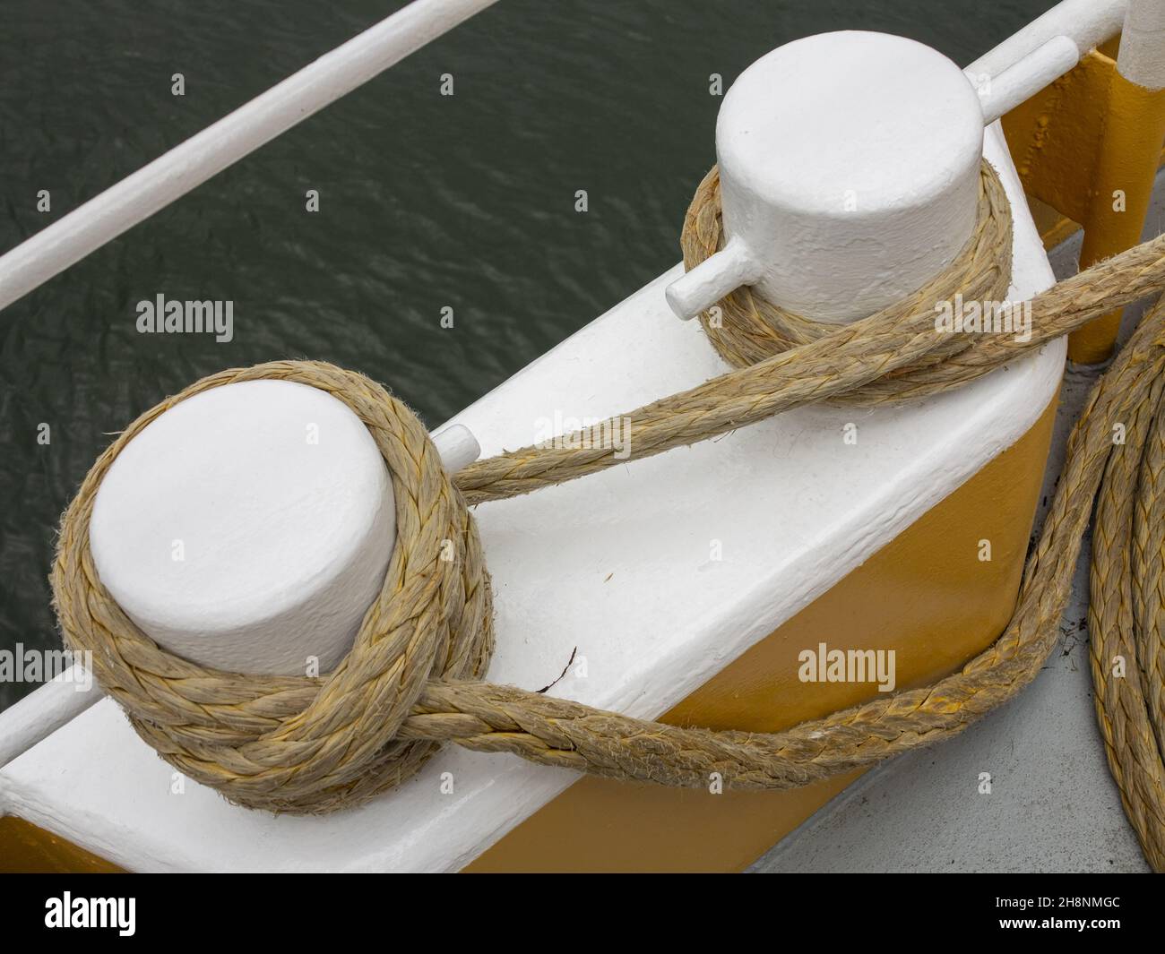 Ropes on the borders of the deck of an old ship Stock Photo - Alamy