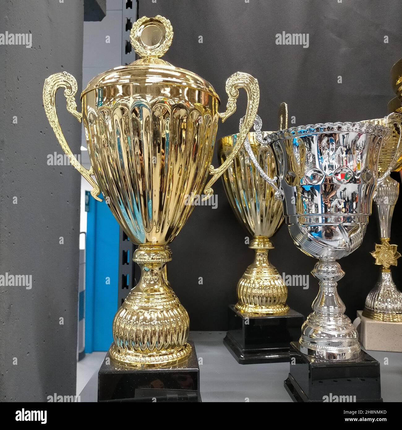 Golden and silver championship cups on the table - sports, success ...