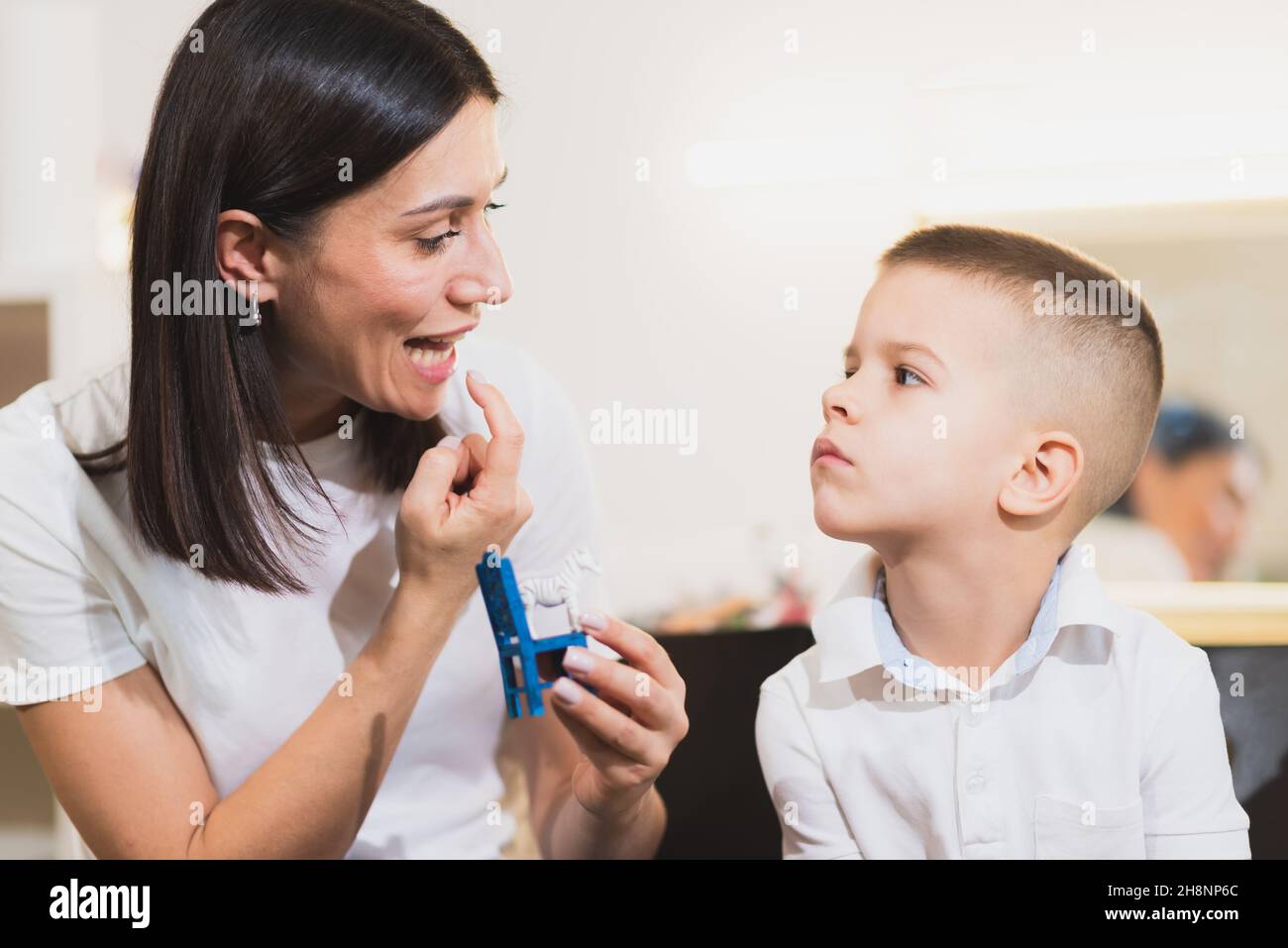 A beautiful woman speech therapist deals with the boy and teaches him ...
