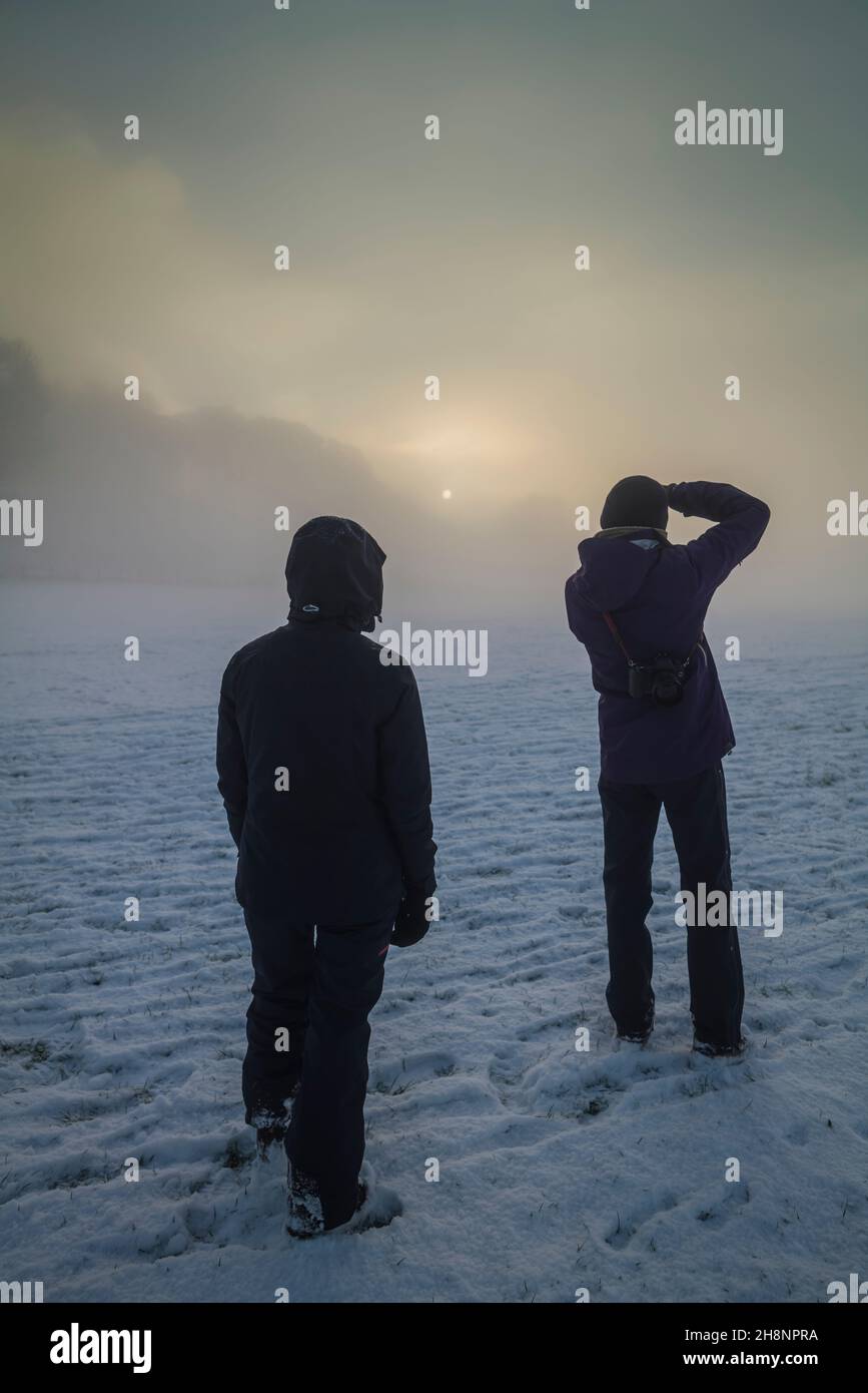 Couple photographing the winter sunset in the Ribble Valley, Lancashire ...