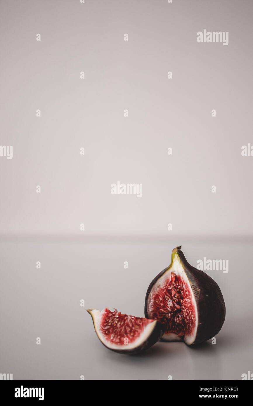 One fig minimalism. One fig in a cut corner parts. Fresh figs on the ...