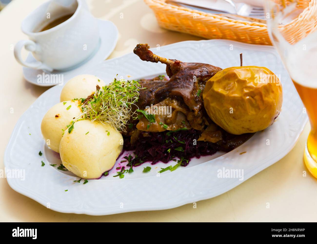 Baked duck with blue cabbage and yeast dumplings Stock Photo - Alamy
