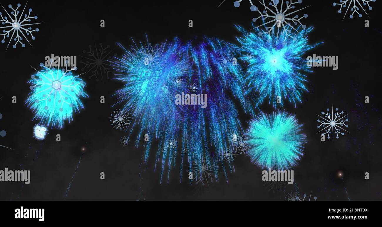 Image of snowflakes and blue christmas and new year fireworks exploding ...