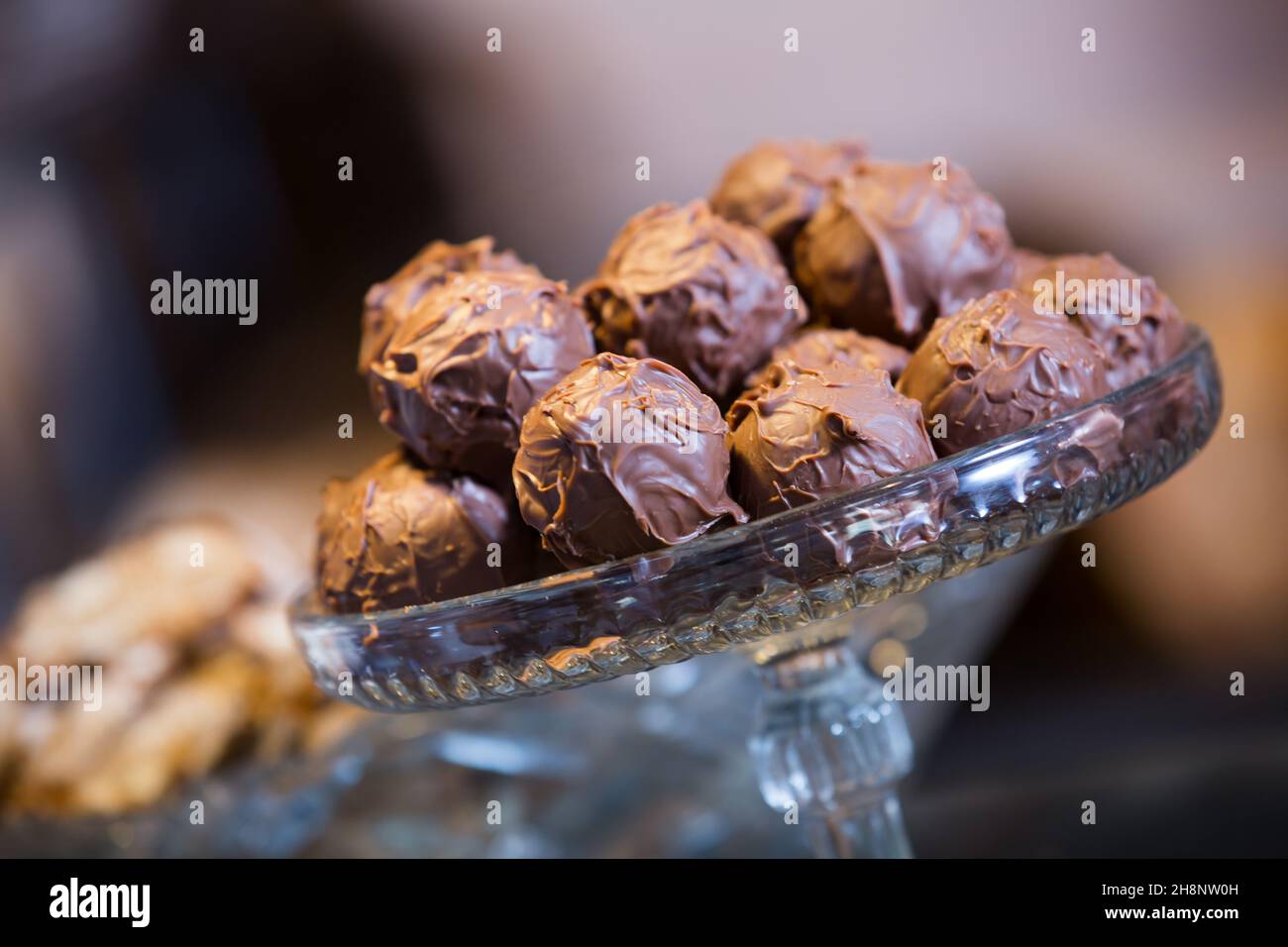 Delicious small chocolates at cafe display Stock Photo - Alamy
