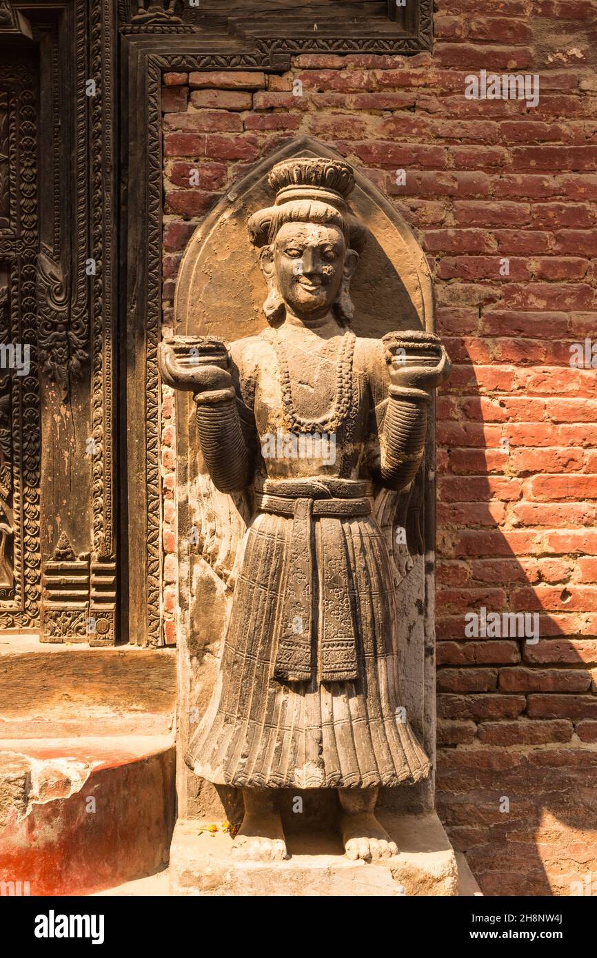 A stone statue guards a palace entrance in Durbar Square in the ...