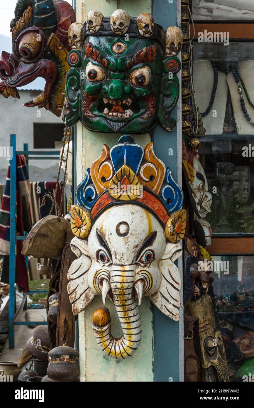 Hand-carved wooden Tibetan masks depicting Mahakala and Vinayaka in a ...