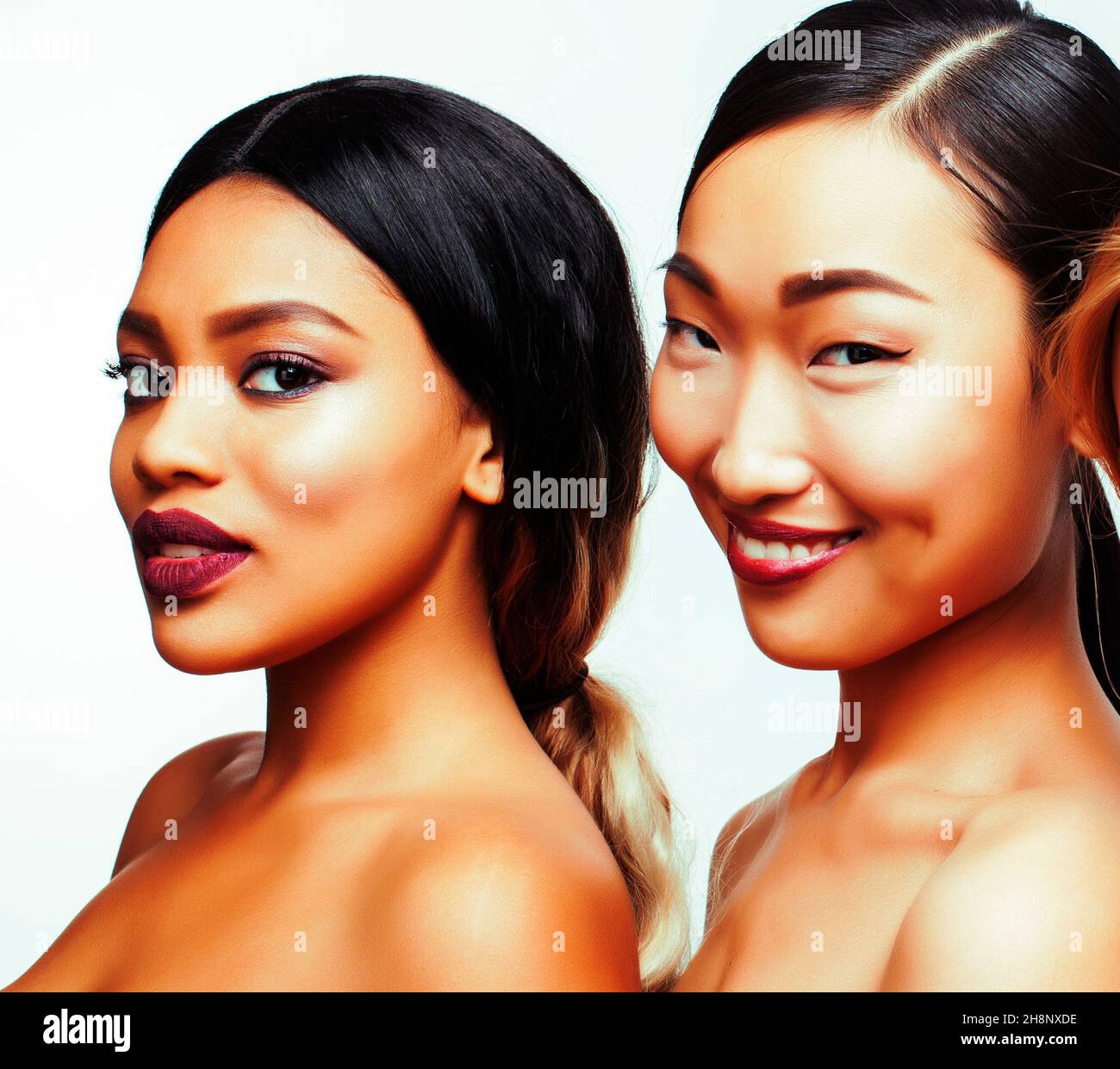 different nation woman: african-american and asian together isolated on ...