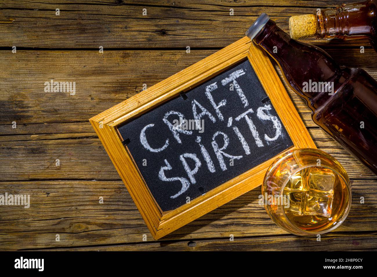 Craft spirit alcohol. Various bottles and glass with hand crafted hard ...