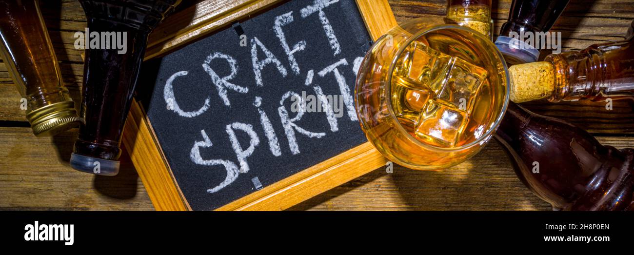 Craft spirit alcohol. Various bottles and glass with hand crafted hard ...