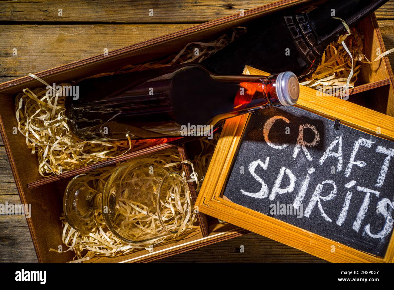 Craft spirit alcohol. Various bottles and glass with hand crafted hard ...