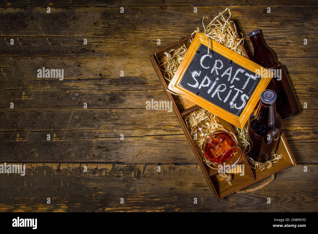 Craft spirit alcohol. Various bottles and glass with hand crafted hard ...