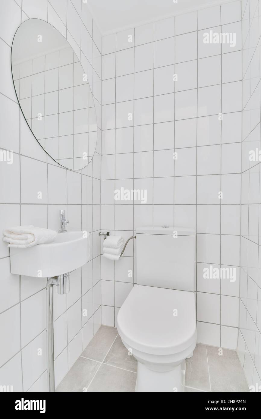 Interior of an attractive restroom with small sink Stock Photo - Alamy