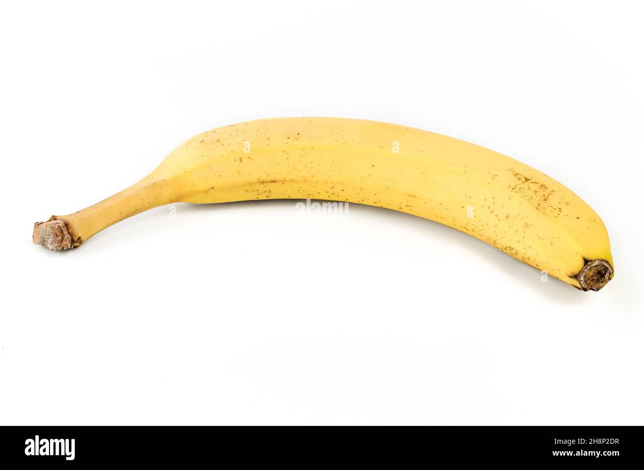 Single banana against white background Stock Photo - Alamy