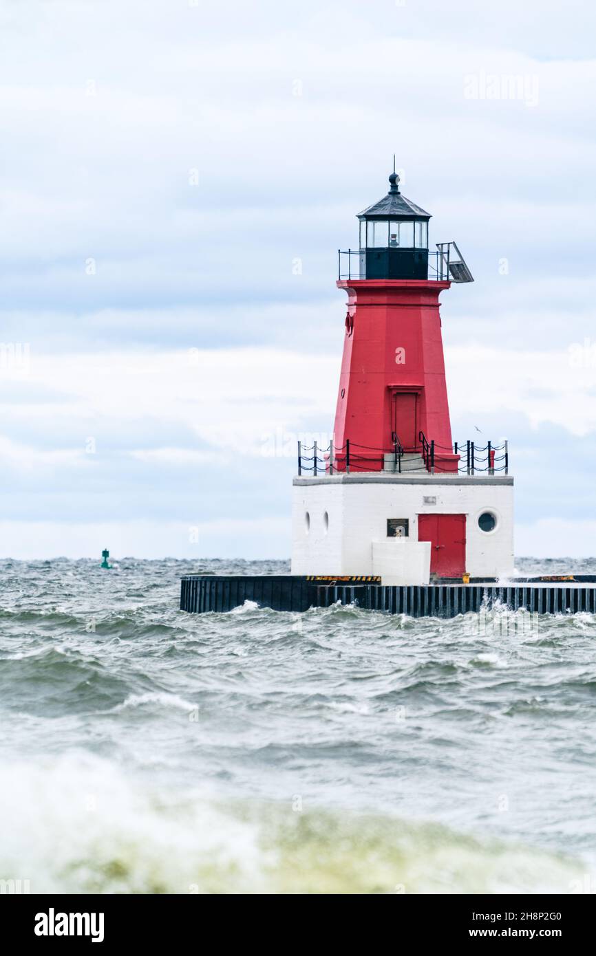 Menominee Pierhead Lighthouse at Ann Arbor Park, as choppy waves of ...