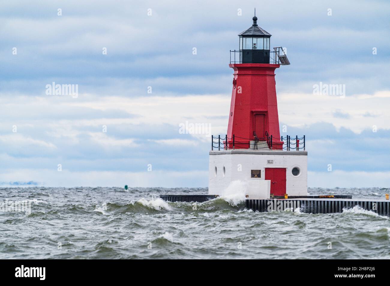 Menominee Pierhead Lighthouse at Ann Arbor Park, as choppy waves of ...