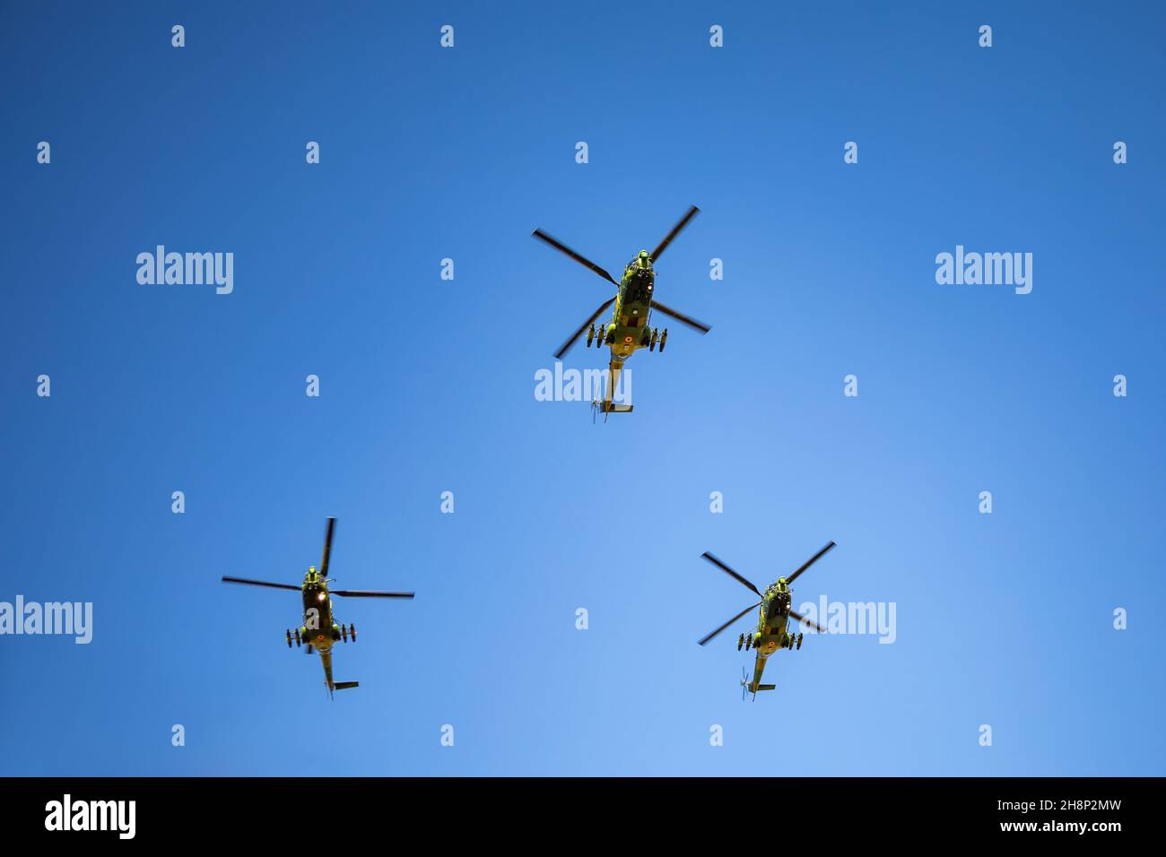 Three helicopters flying in formation hi-res stock photography and ...