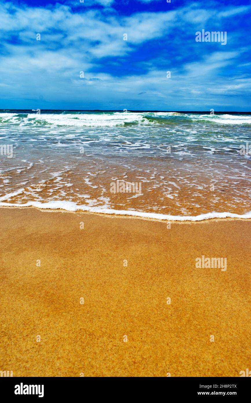 Empty white sand beach on an island Stock Photo - Alamy